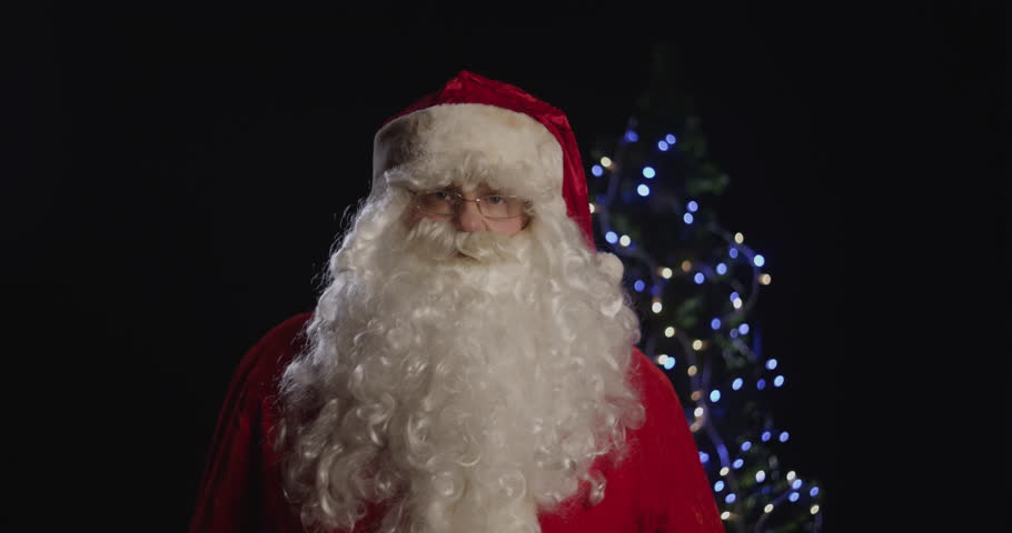 Close Up Of Santa Claus Against Black Background Clapping Hands In The ...