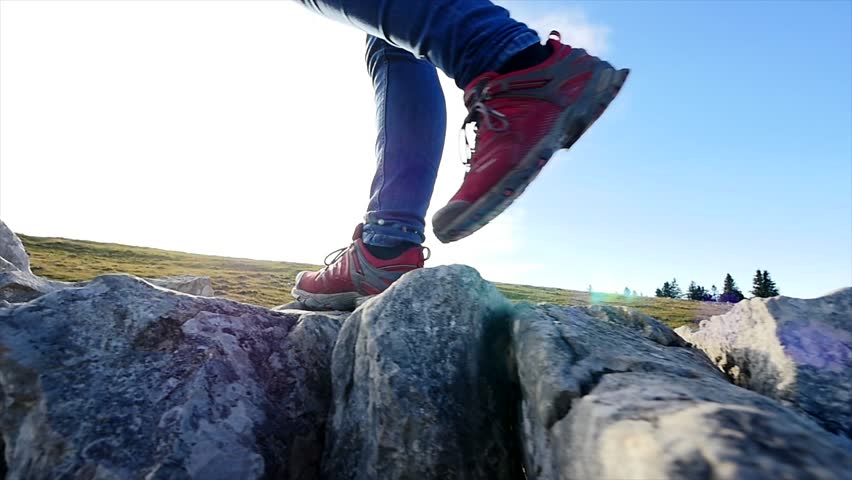 Female Hiker Walking On Rough Terrain. Foot Steps In Slow Motion ...