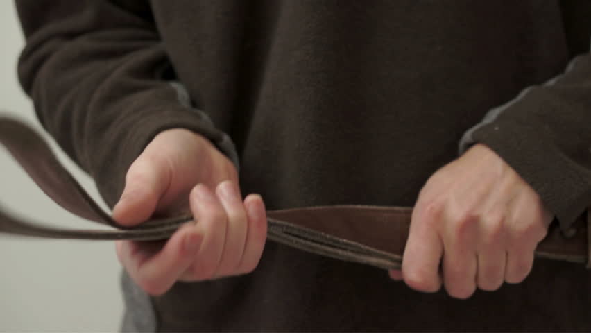 Angry Man Pulls A Leather Belt Through His Clenched Hand Getting Ready ...