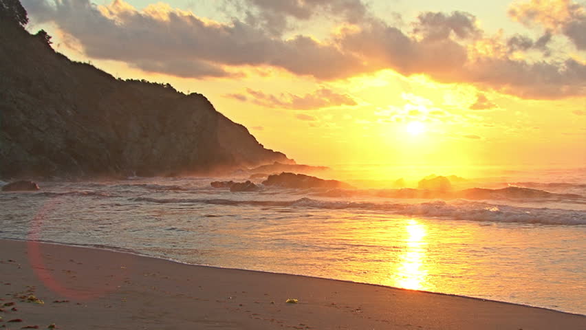 Stock video of sunrise on the beach rocks - | 8958280 | Shutterstock